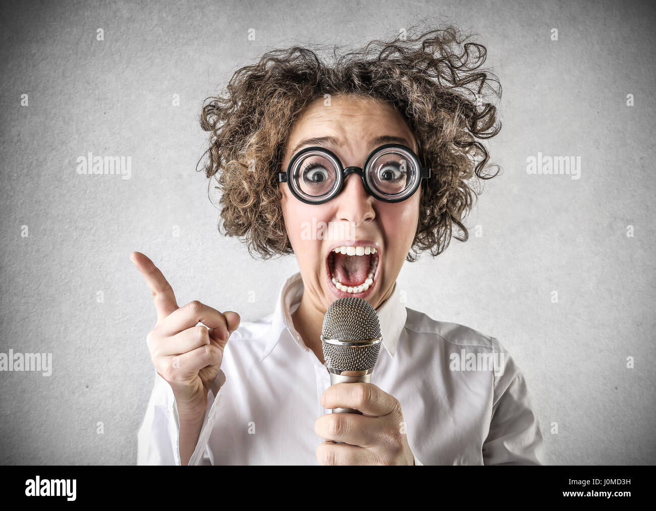 Woman yelling at tv hi-res stock photography and images - Alamy
