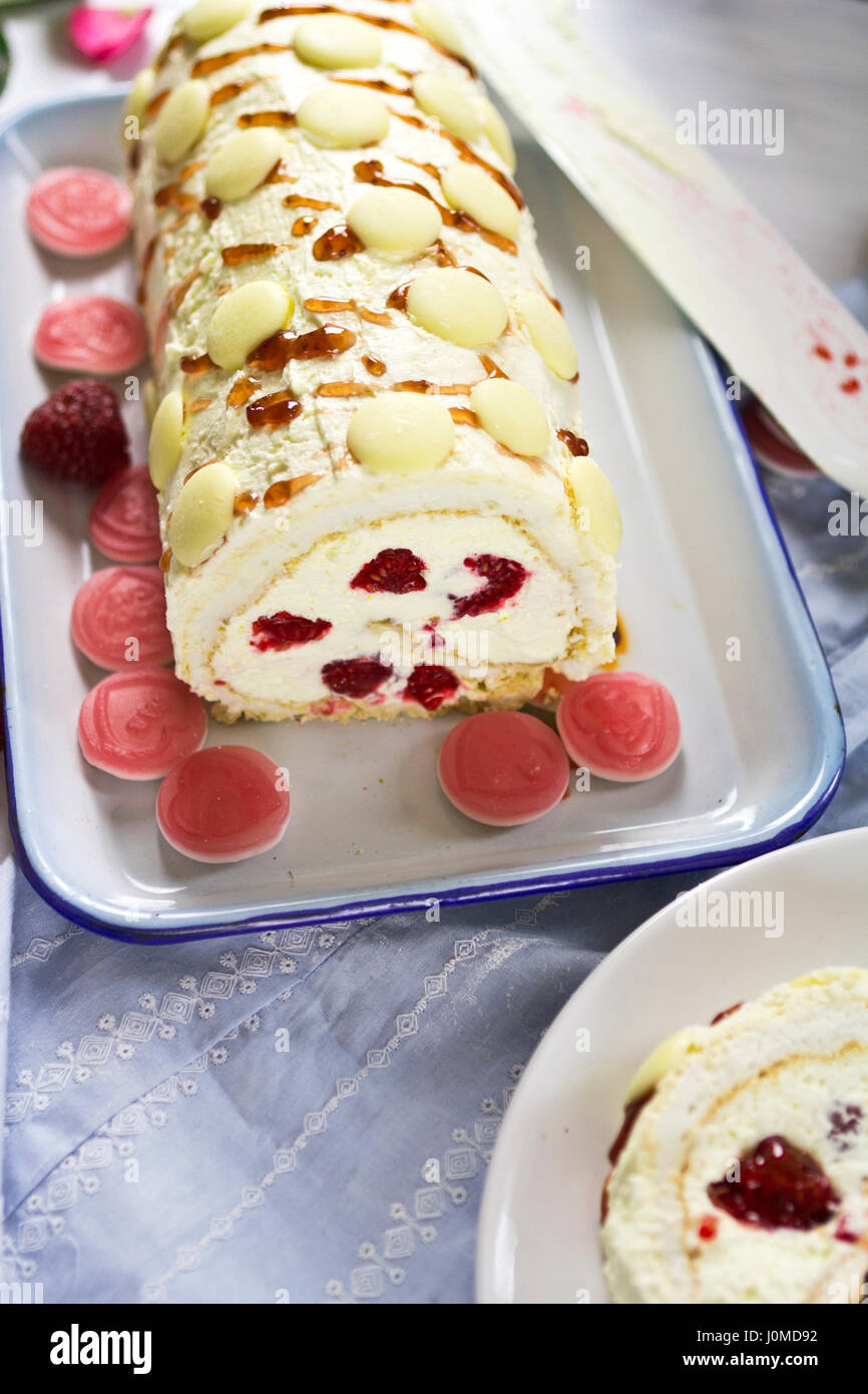 Valentines raspberry roulade with cream Stock Photo - Alamy