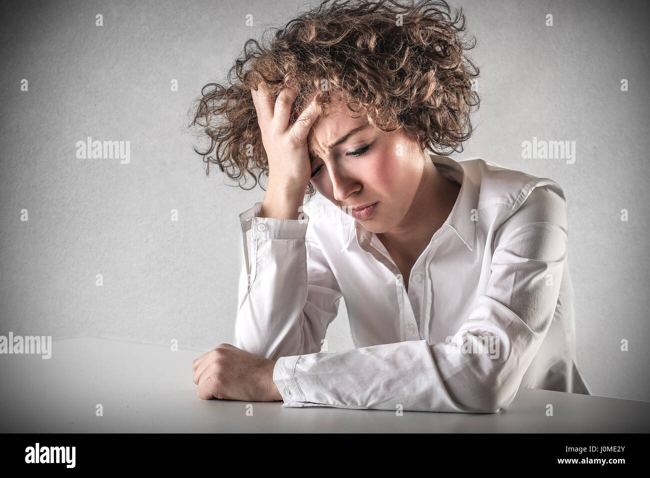 Brunette businesswoman being stressed Stock Photo - Alamy