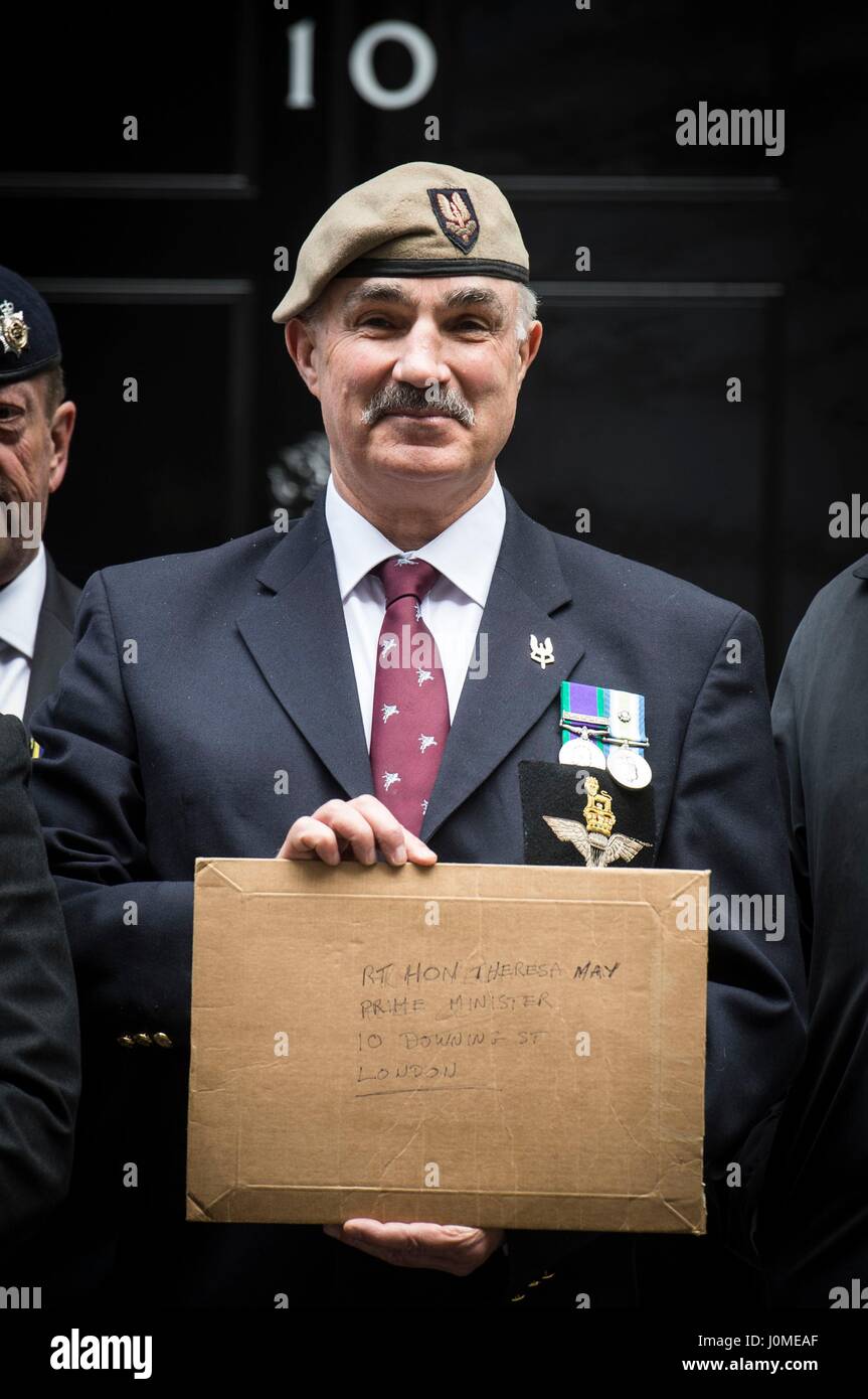 Robin Horsfall hands a letter to Downing Street after a military ...