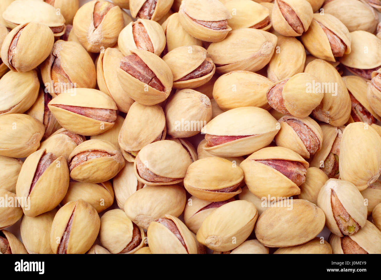 Background texture of pistachio nuts (Pistacia vera) in their shells ...