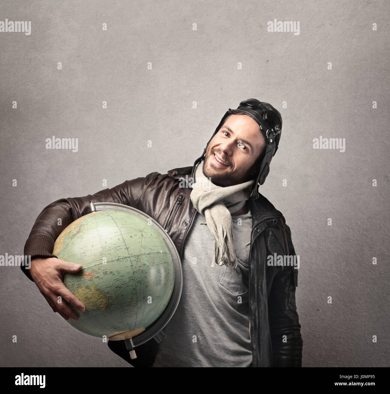Man holding globe Stock Photo - Alamy