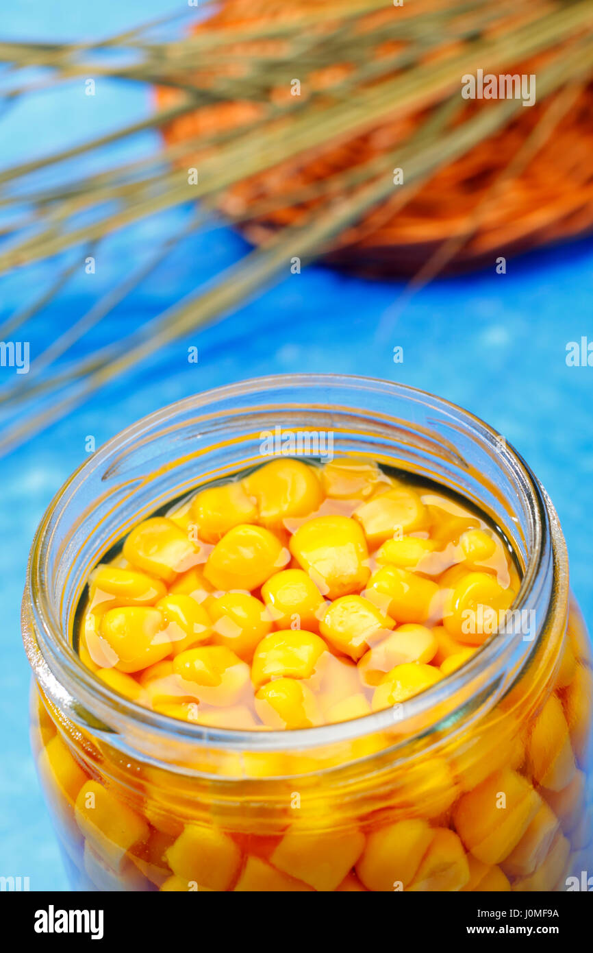 Preserved sweetcorn in opened jar with unfocused background Stock Photo ...