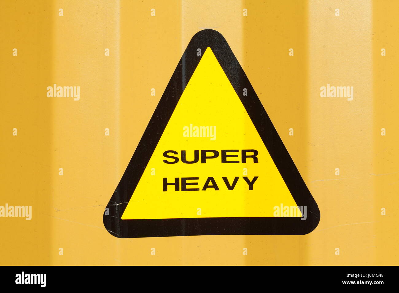 Sign Super Heavy on a yellow Container Stock Photo - Alamy
