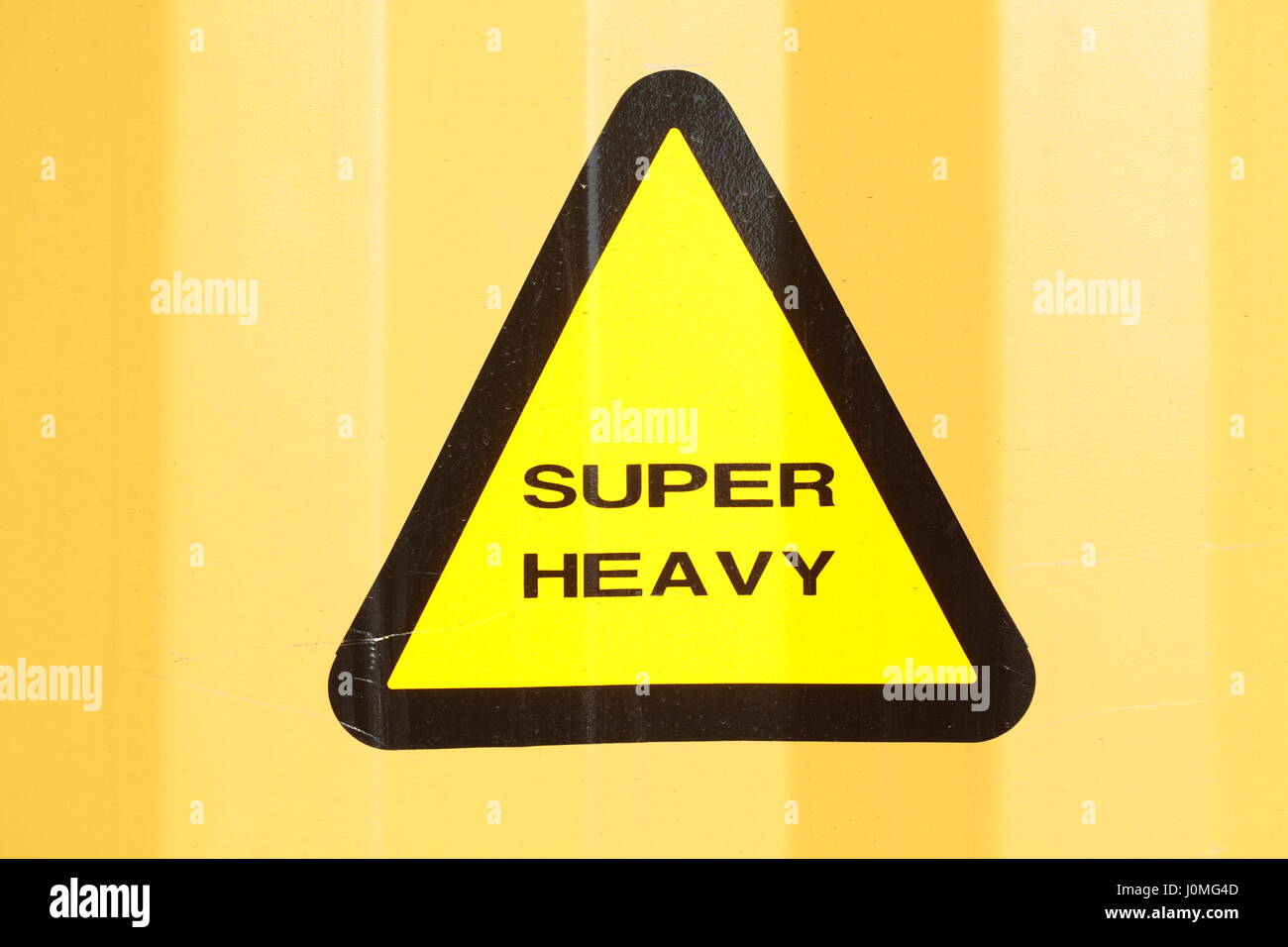Sign Super Heavy on a yellow Container Stock Photo - Alamy