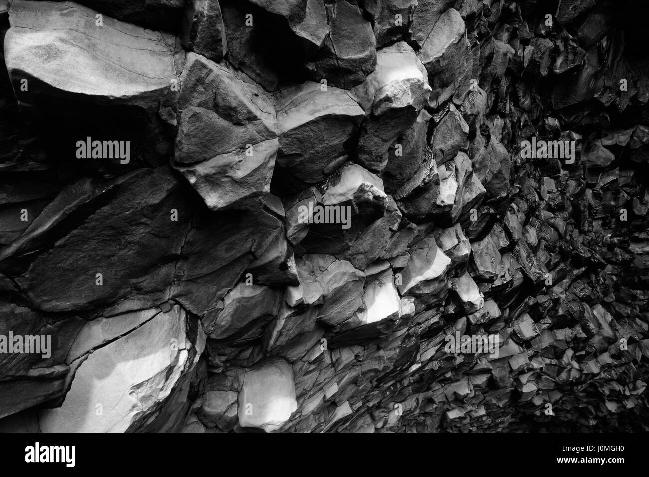 Natural basalt stone columns on Reynisfjara beach near the town of Vik ...