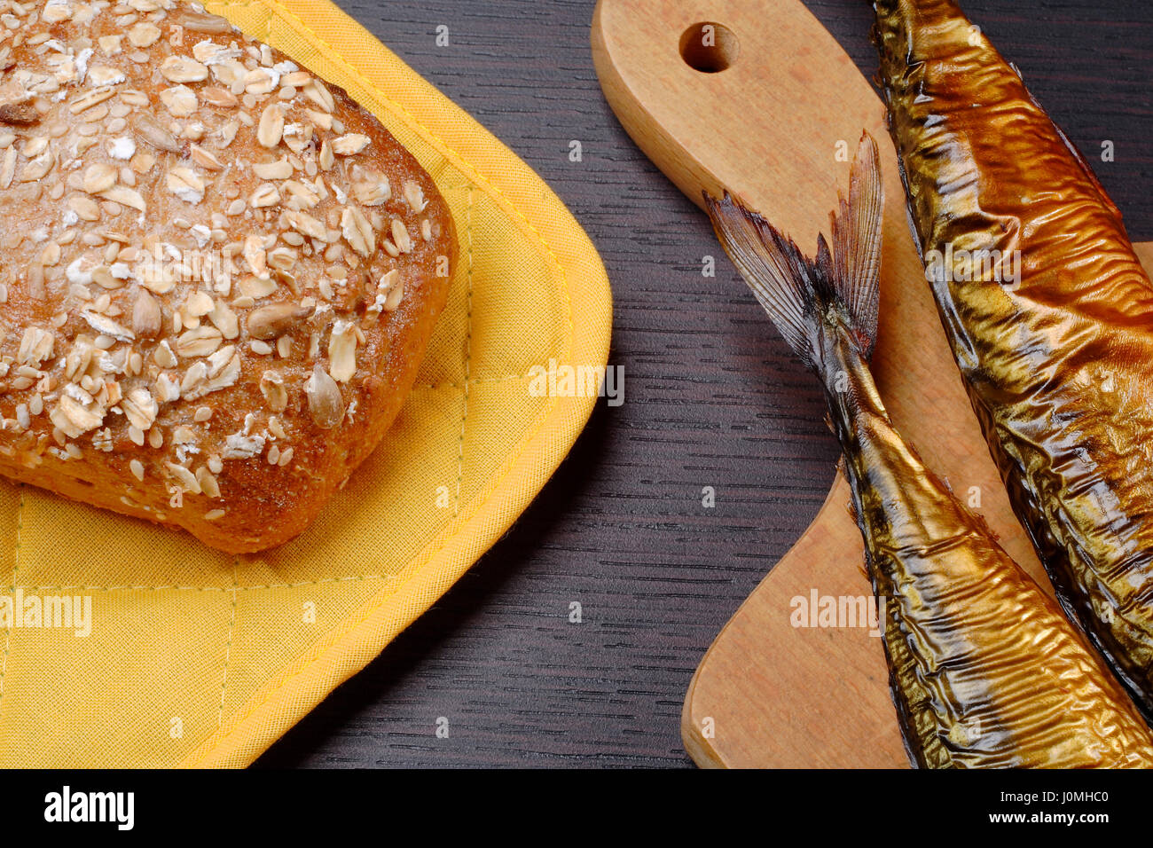 Still life with two smoke-dried mackerel and bread Stock Photo - Alamy