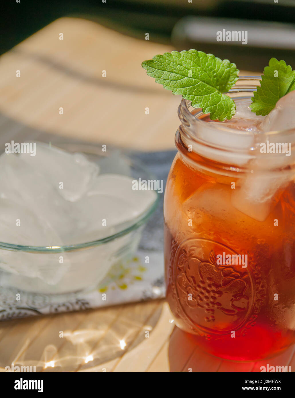 A refreshing drink with mint in the sunlight Stock Photo - Alamy