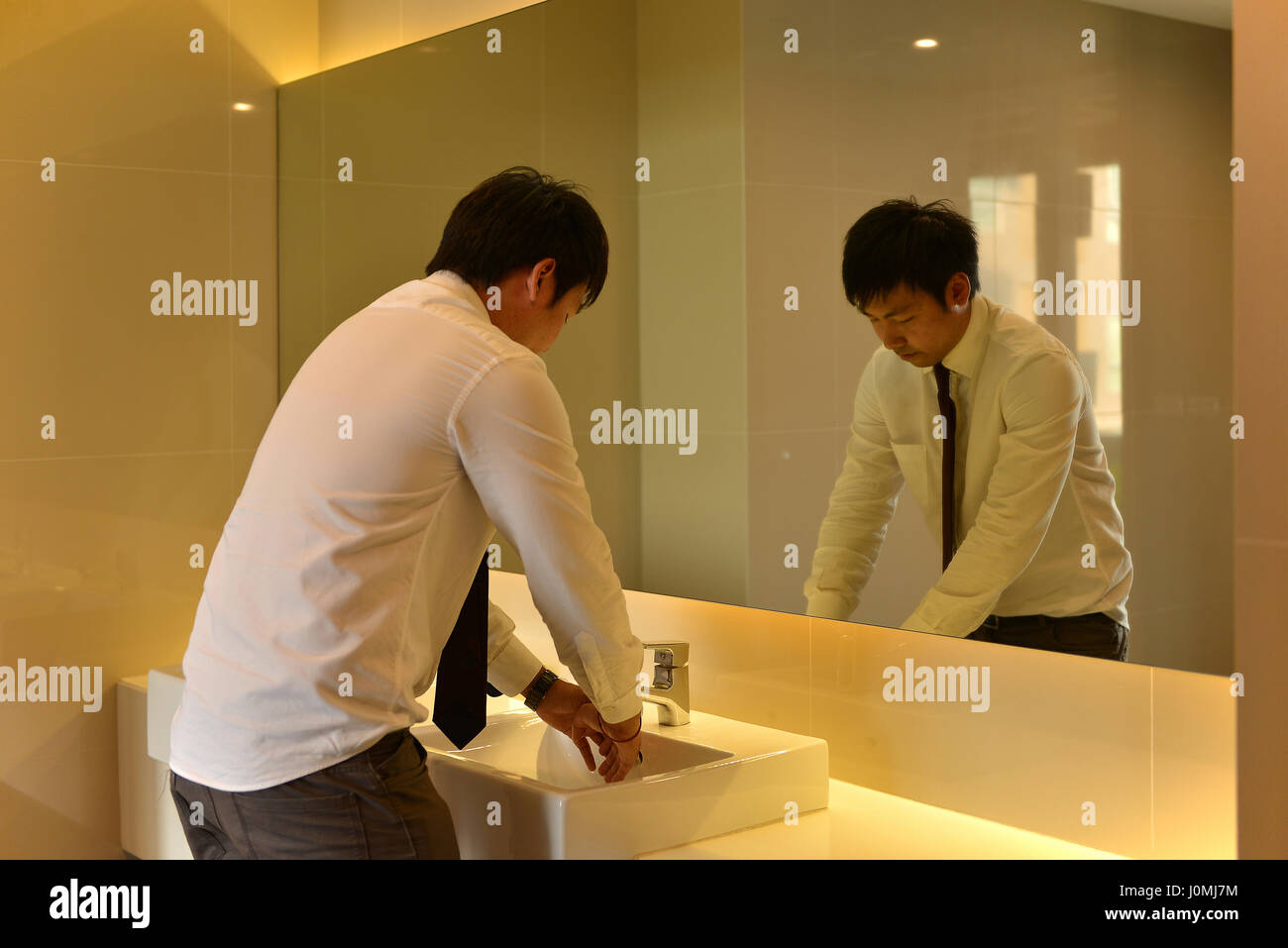 Person in restroom hi-res stock photography and images - Alamy