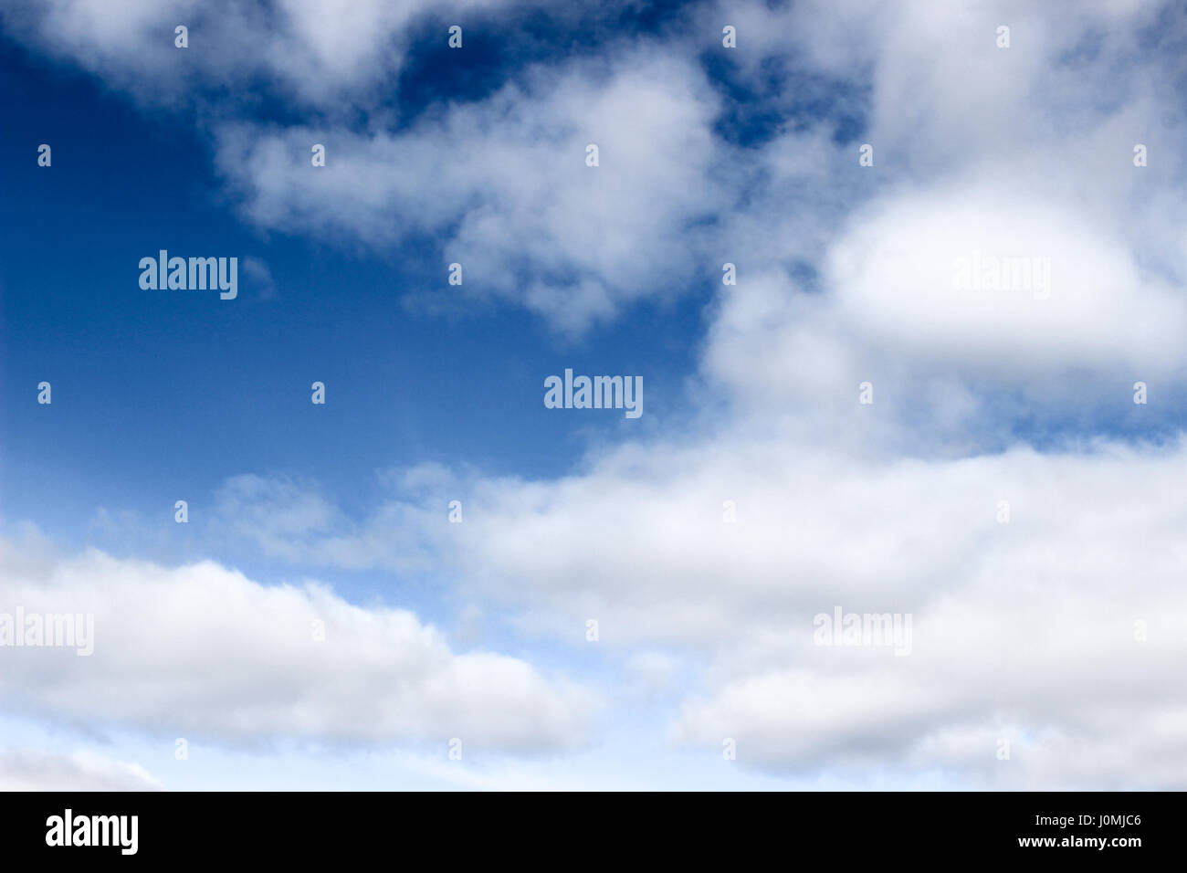 cloud-filled blue sky Stock Photo - Alamy