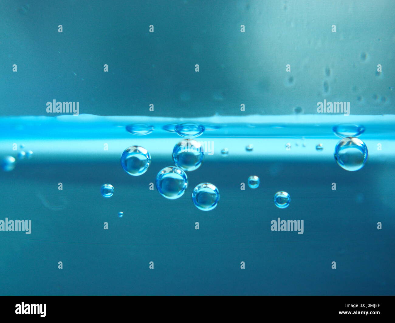 Extreme close up of oxygen bubbles in water Stock Photo - Alamy