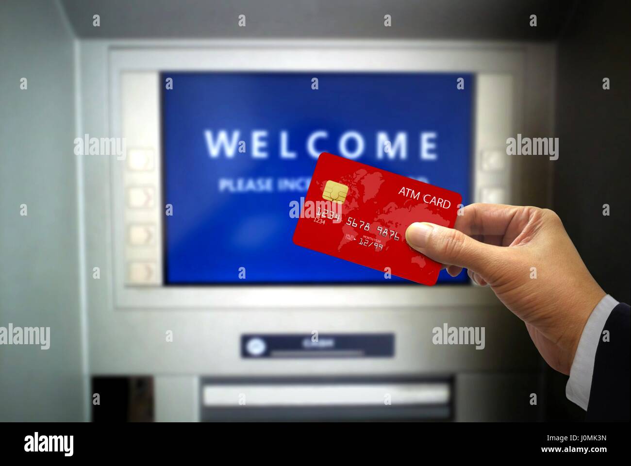 Hand Holding ATM Card at ATM machines Stock Photo - Alamy