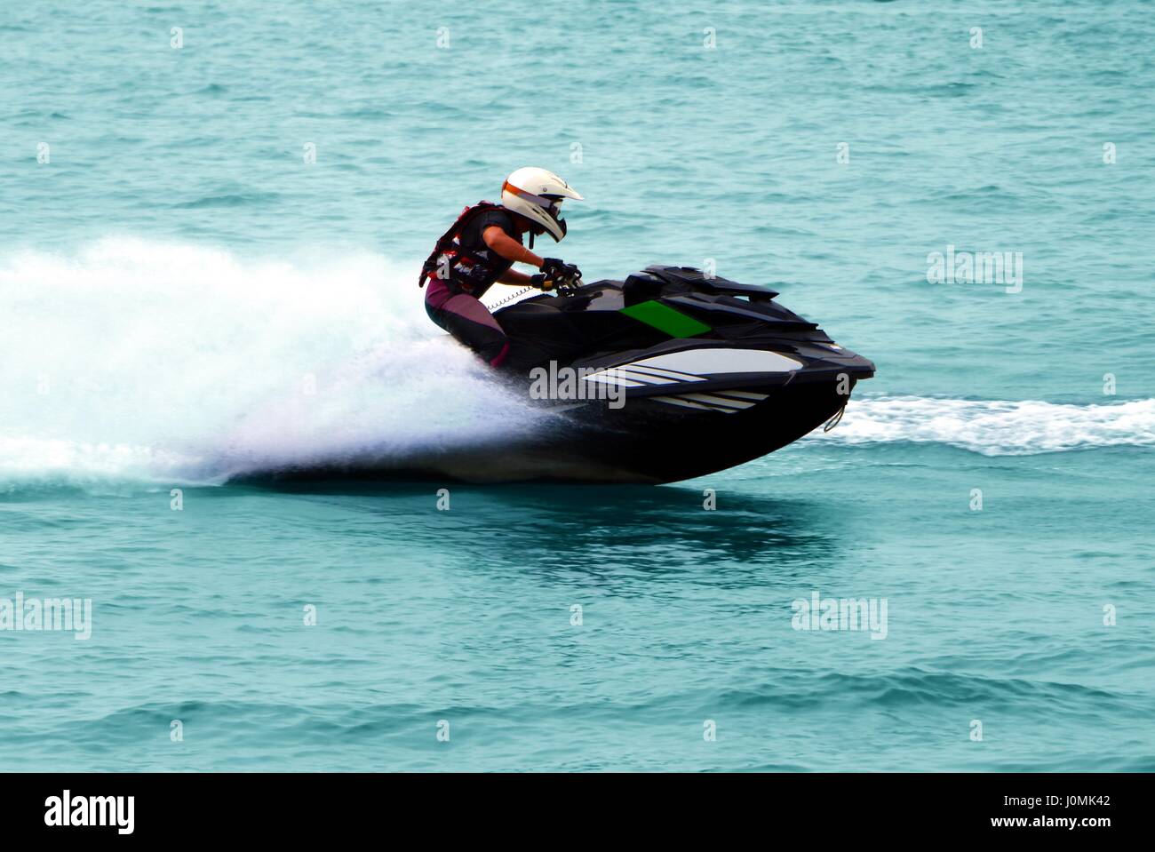 Man on high speed Jet Ski Stock Photo - Alamy