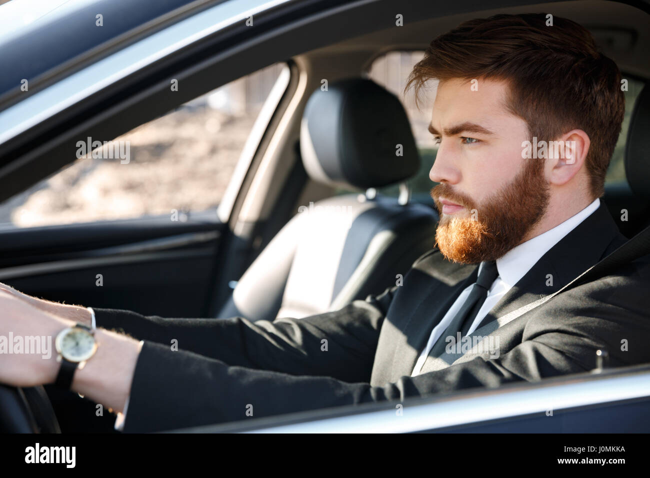 Man Driving Car Side View