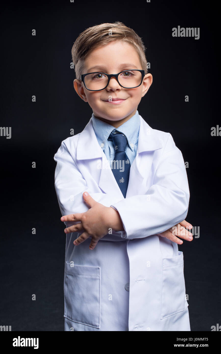 Little boy scientist in eyeglasses and lab coat smiling at camera Stock ...