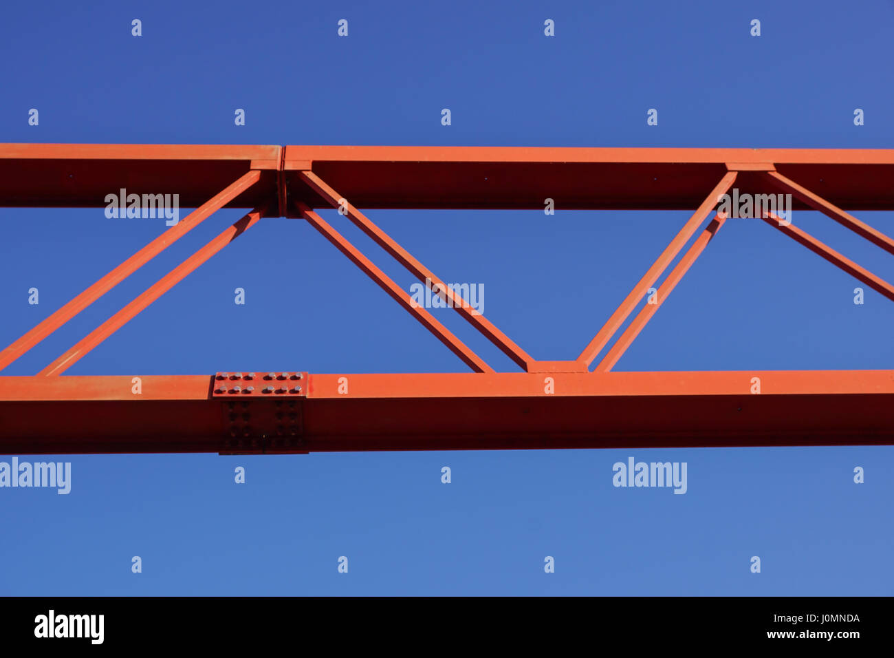 Details of a red modern bridge design and structure Stock Photo - Alamy