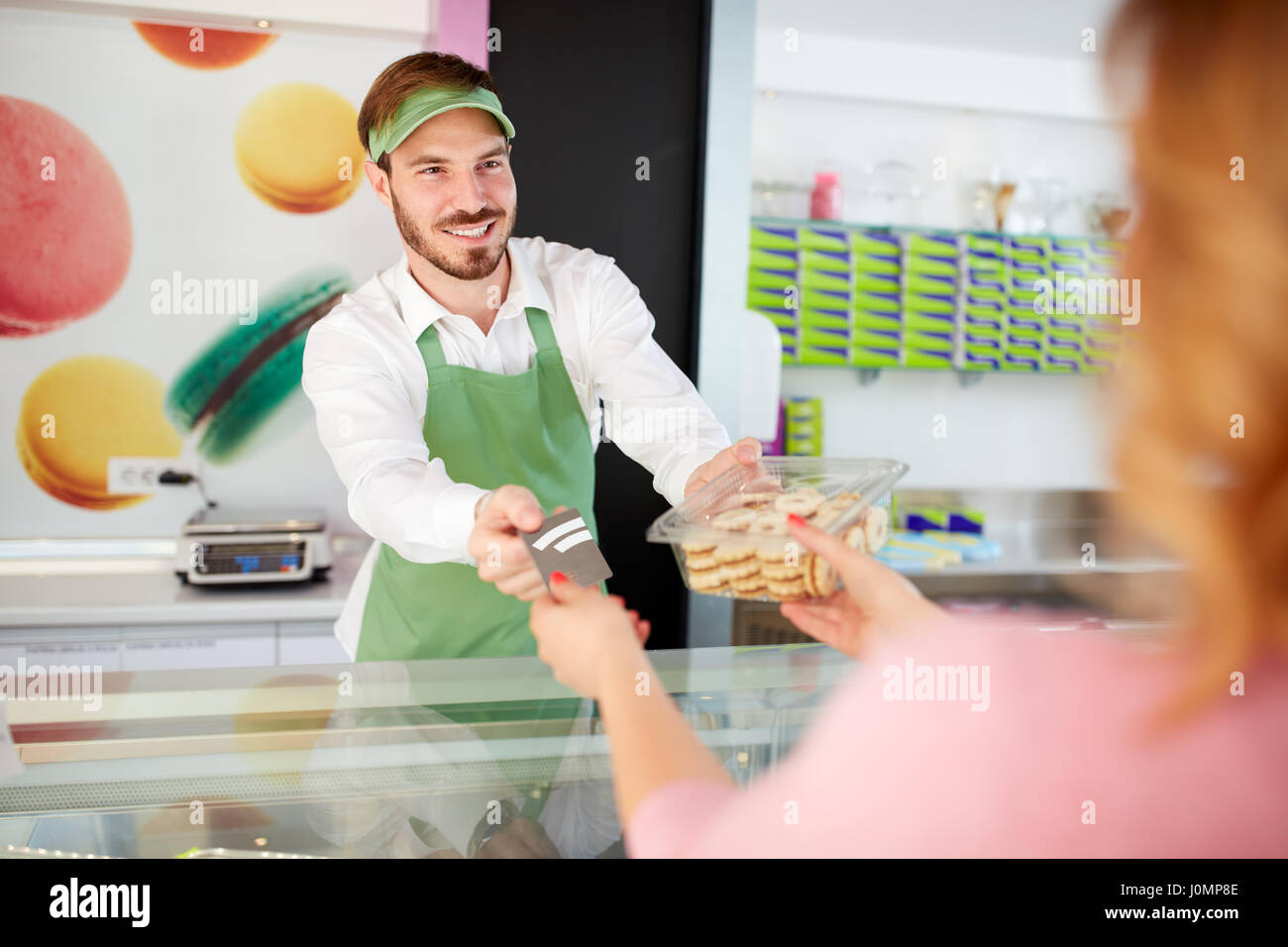 Vendor selling sweets in confectionery shop Stock Photo - Alamy