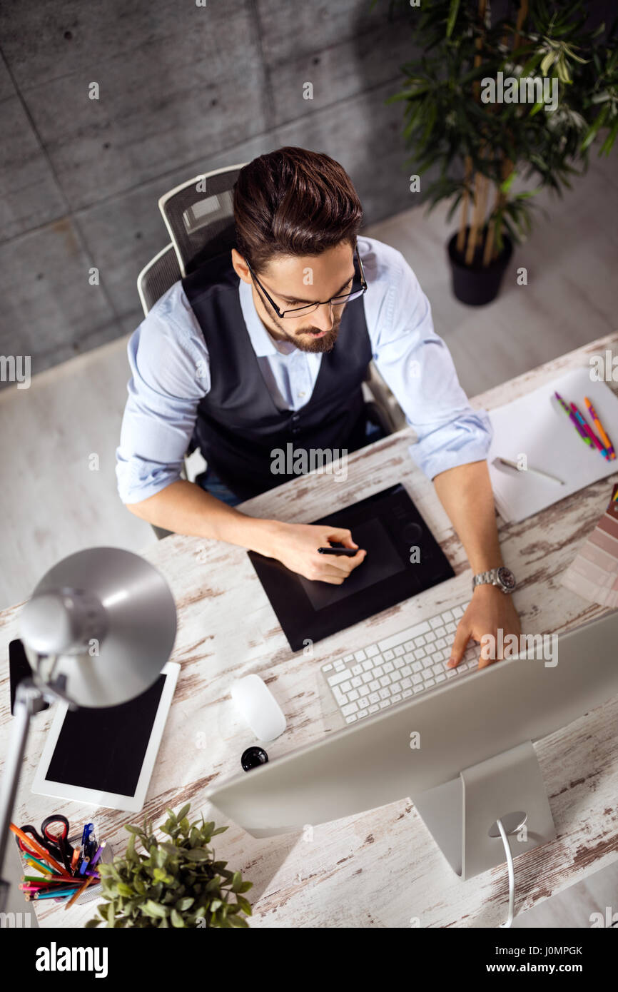 designer using graphics table to do his work at desk Stock Photo - Alamy