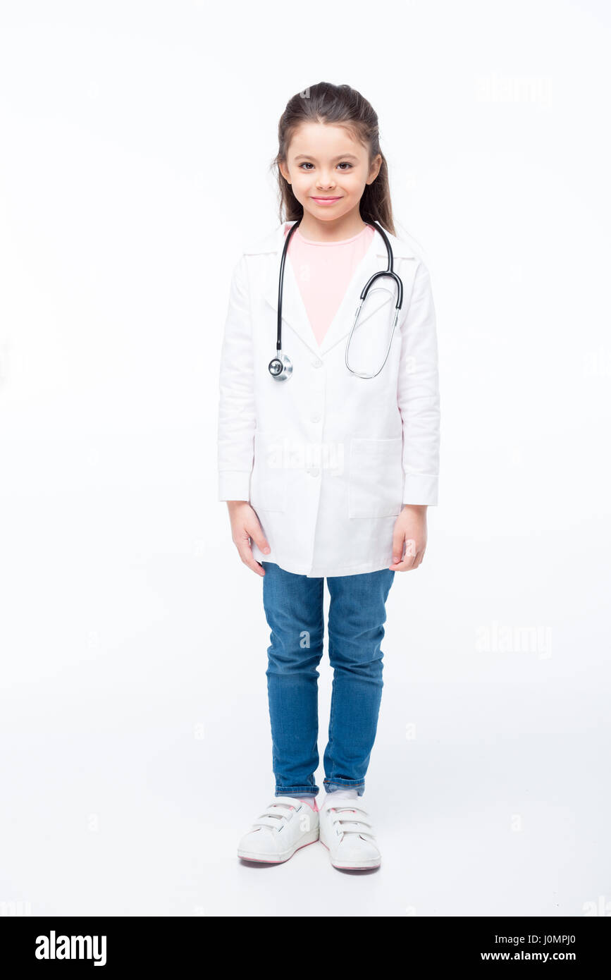 Full length portrait of smiling girl in medical uniform with ...