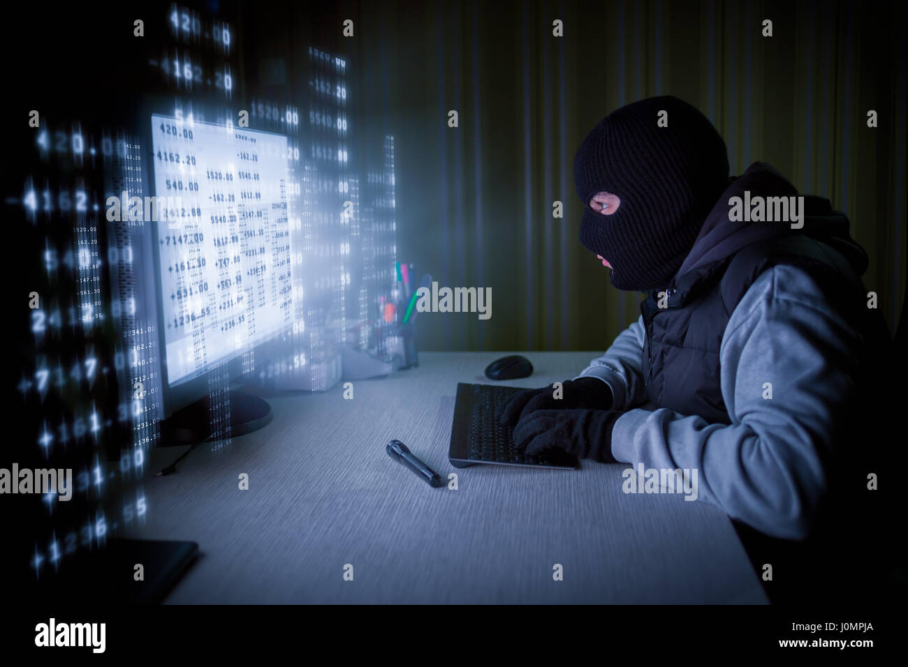 Computer hacker stealing data from a computer, concept for network ...