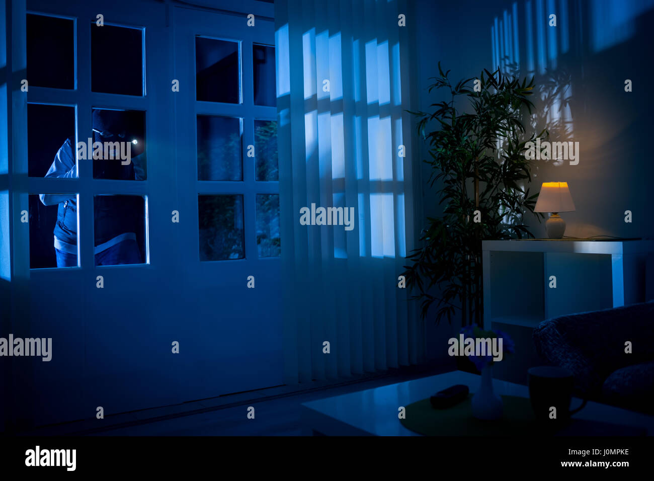 Criminal breaking house through window hi-res stock photography and ...