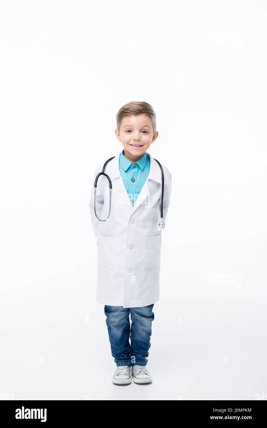 Full length portrait of cute little boy in doctor costume with ...