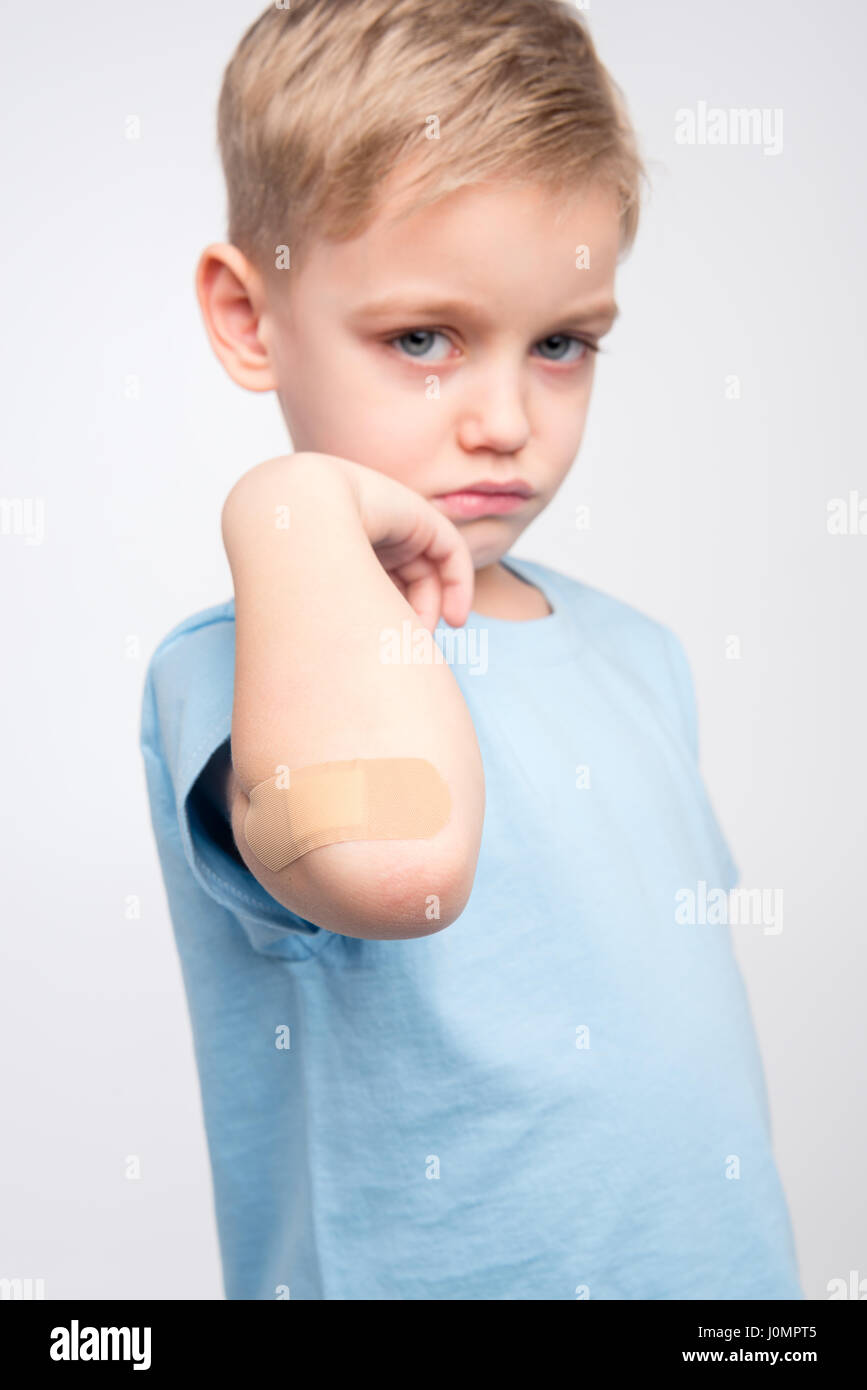 Boy showing injured elbow hi-res stock photography and images - Alamy
