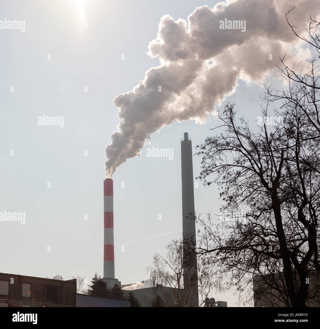 Dense smoke from chimney polluting air Stock Photo - Alamy