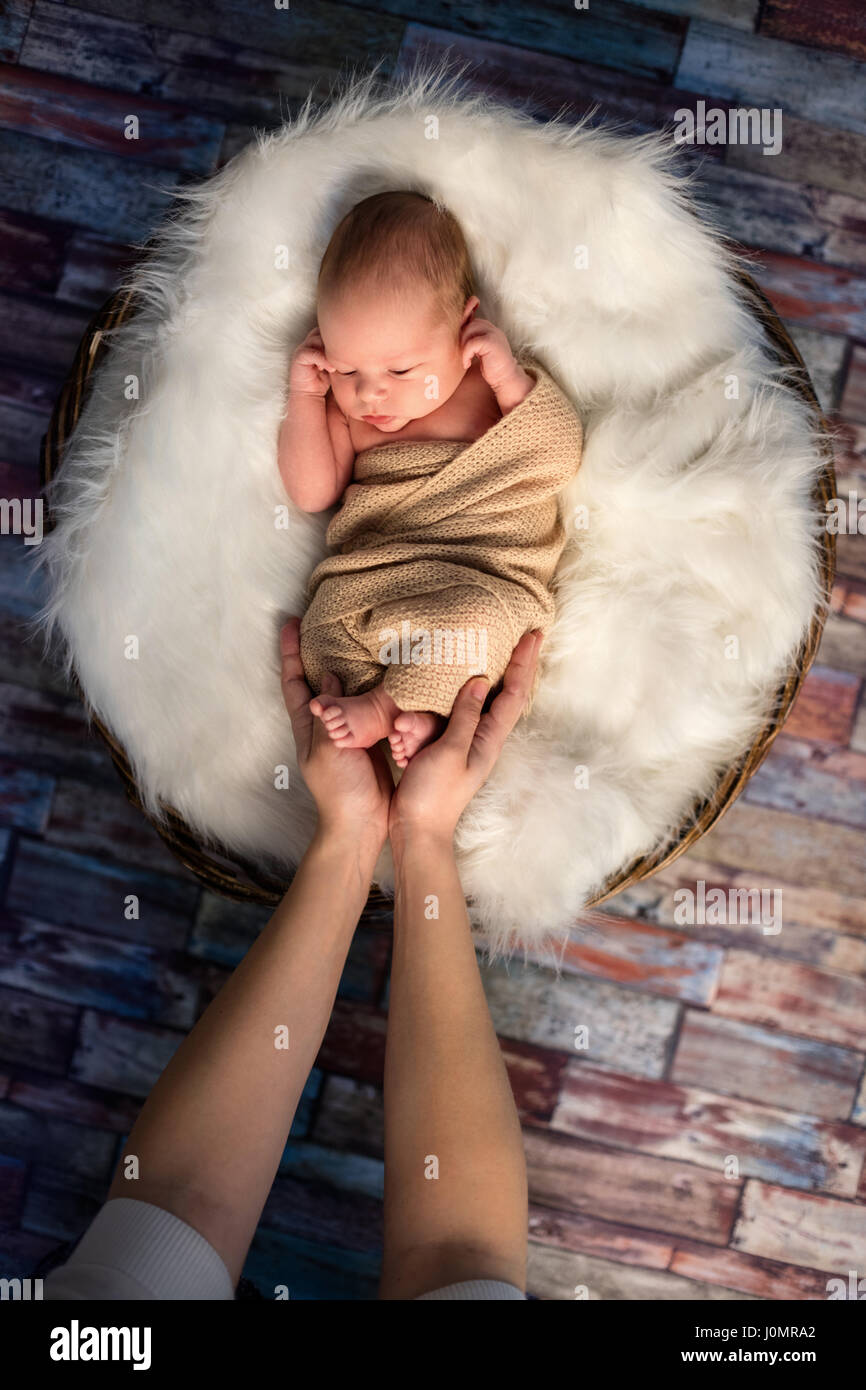 newborn child, mom touch small newborn kid, family help care concept ...