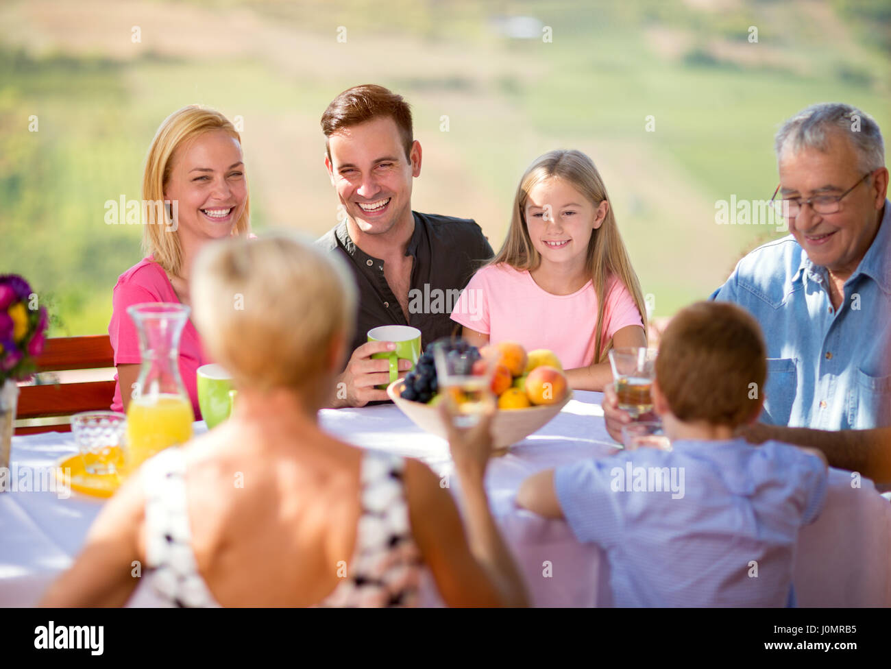 Picnic in garden with happy family outdoor Stock Photo - Alamy