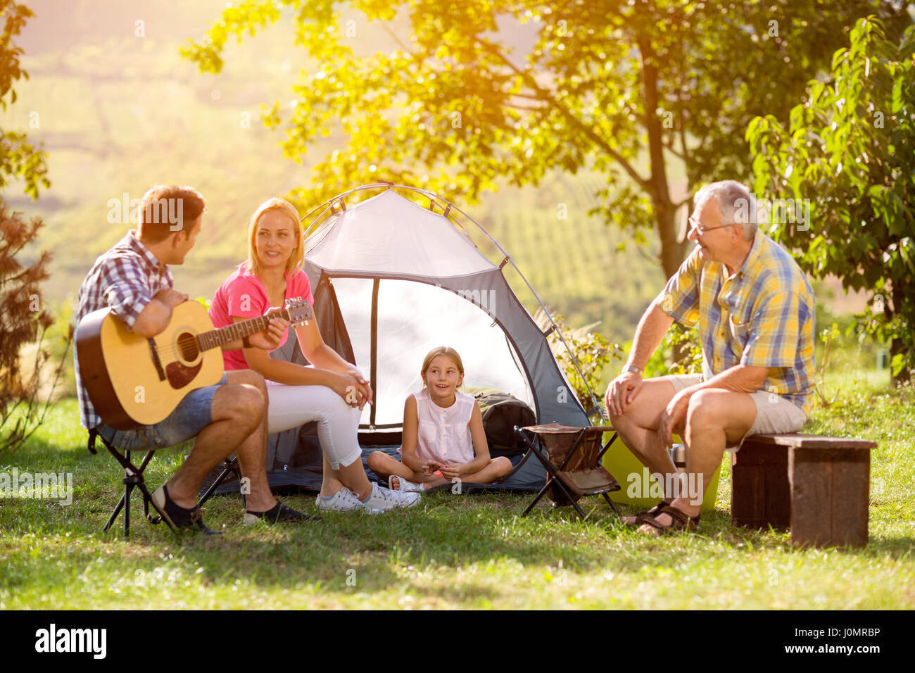Family camping in the countryside with tent Stock Photo - Alamy