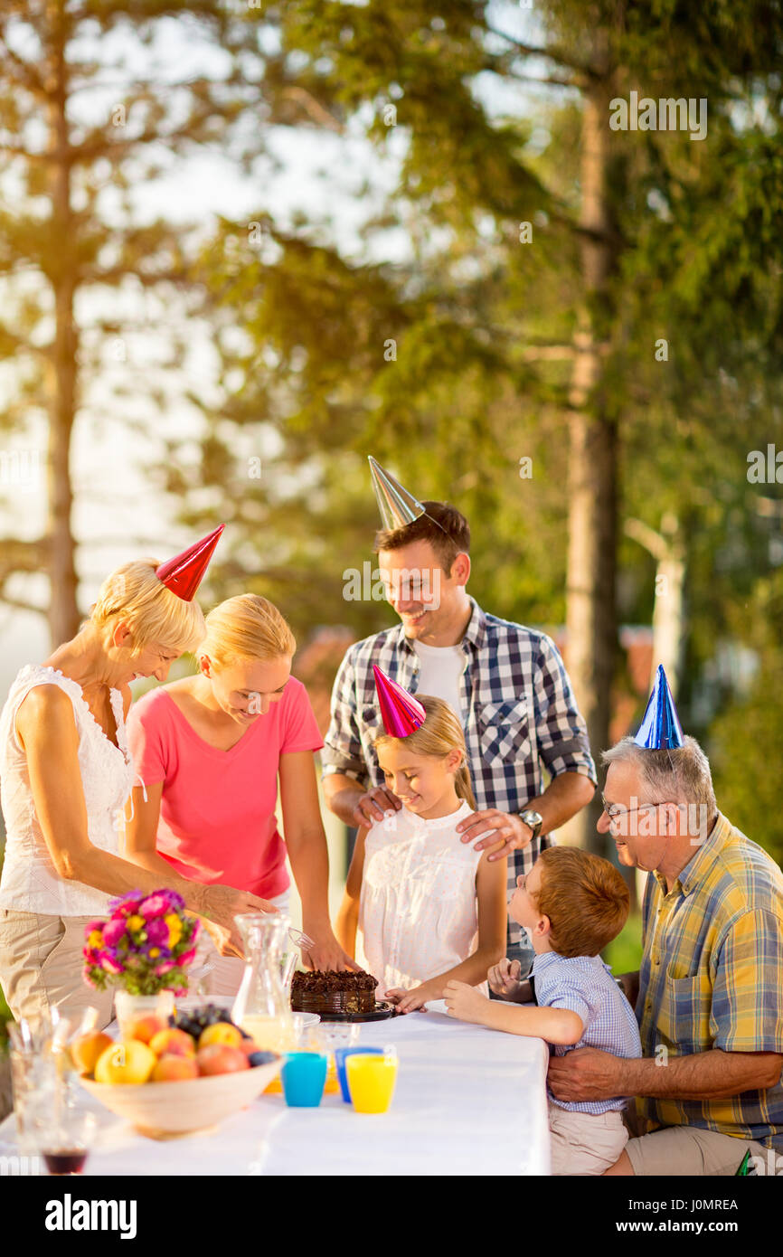 Family celebrating children birthday party Stock Photo - Alamy