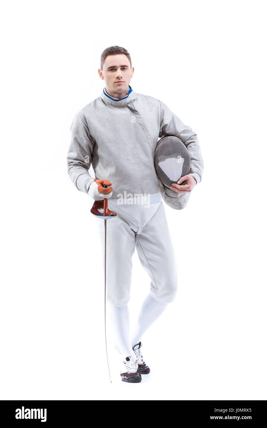 Young confident man professional fencer standing with helmet and rapier ...