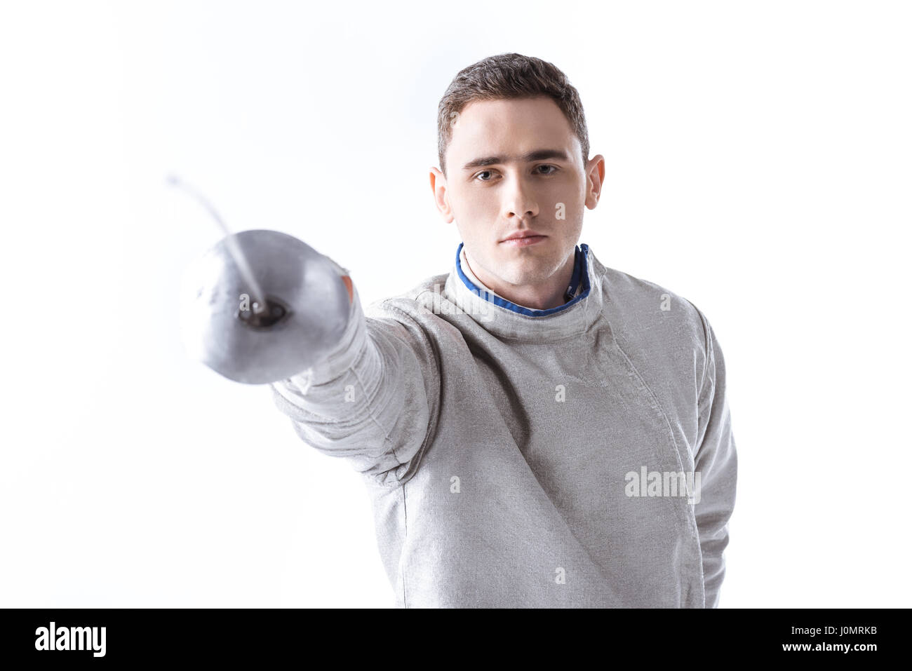 Young man professional fencer practicing in fencing with rapier on ...