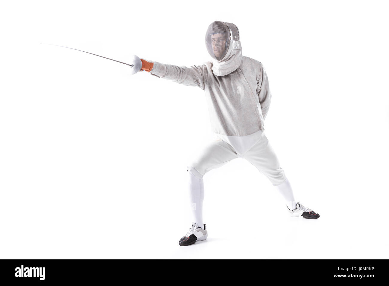 side view of fencer in uniform training with rapier on white Stock ...