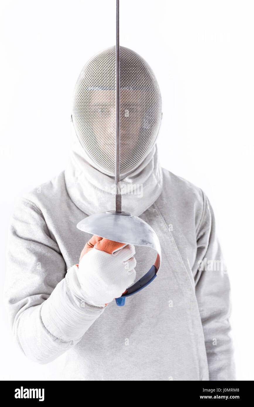 portrait of fencer in uniform holding rapier in hand on white Stock ...