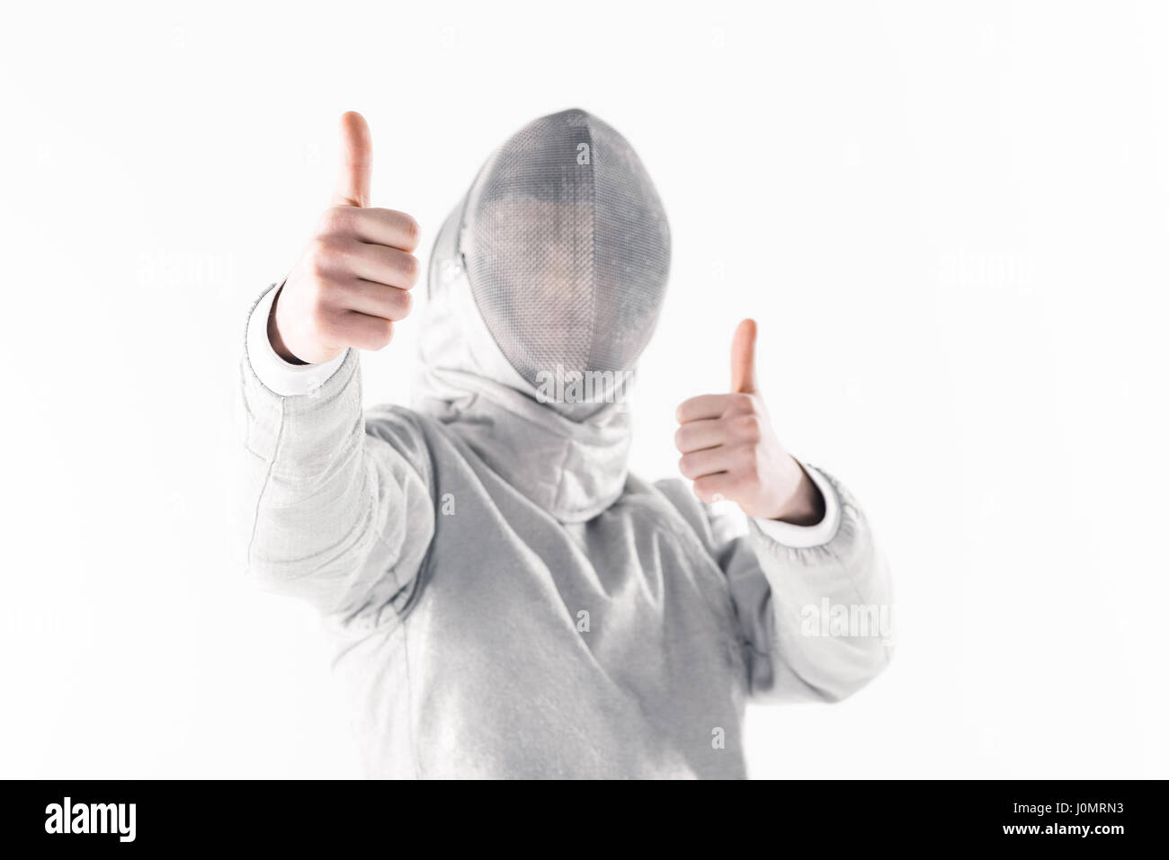 Portrait of professional fencer in fencing mask with thumbs up on white ...