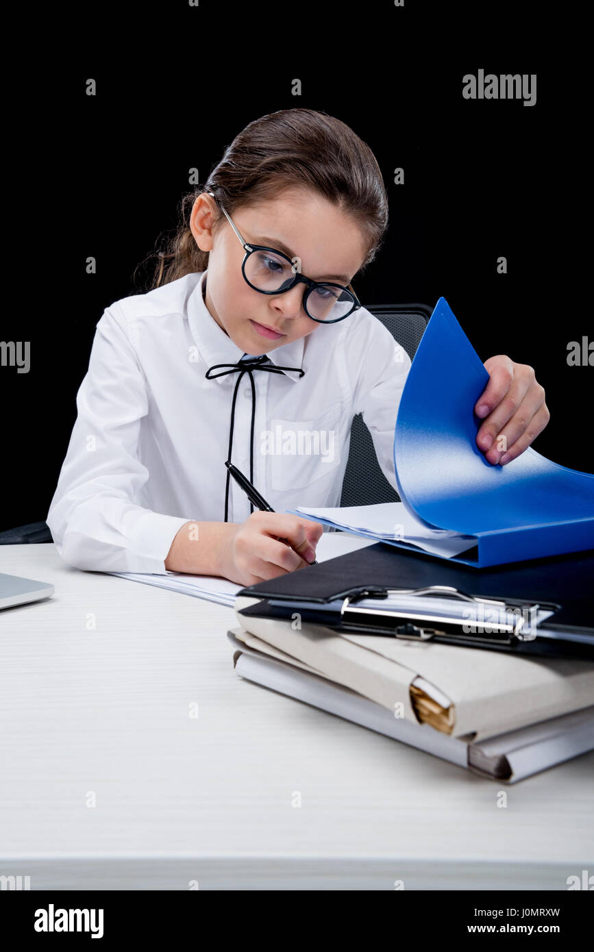 portrait of concentrated girl working with documents at workplace Stock ...
