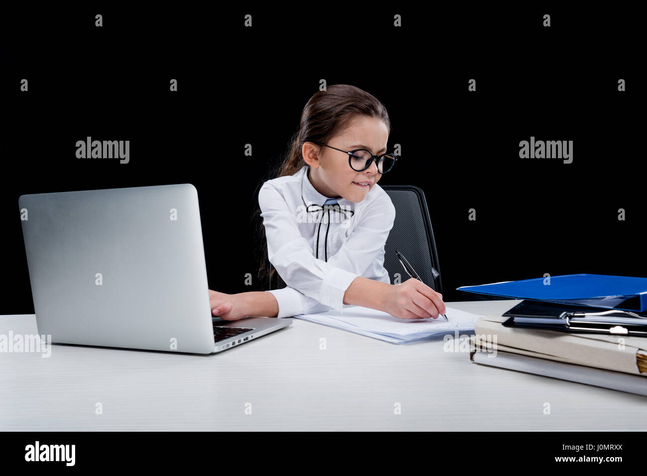 Girl working with documents at workplace on black Stock Photo - Alamy