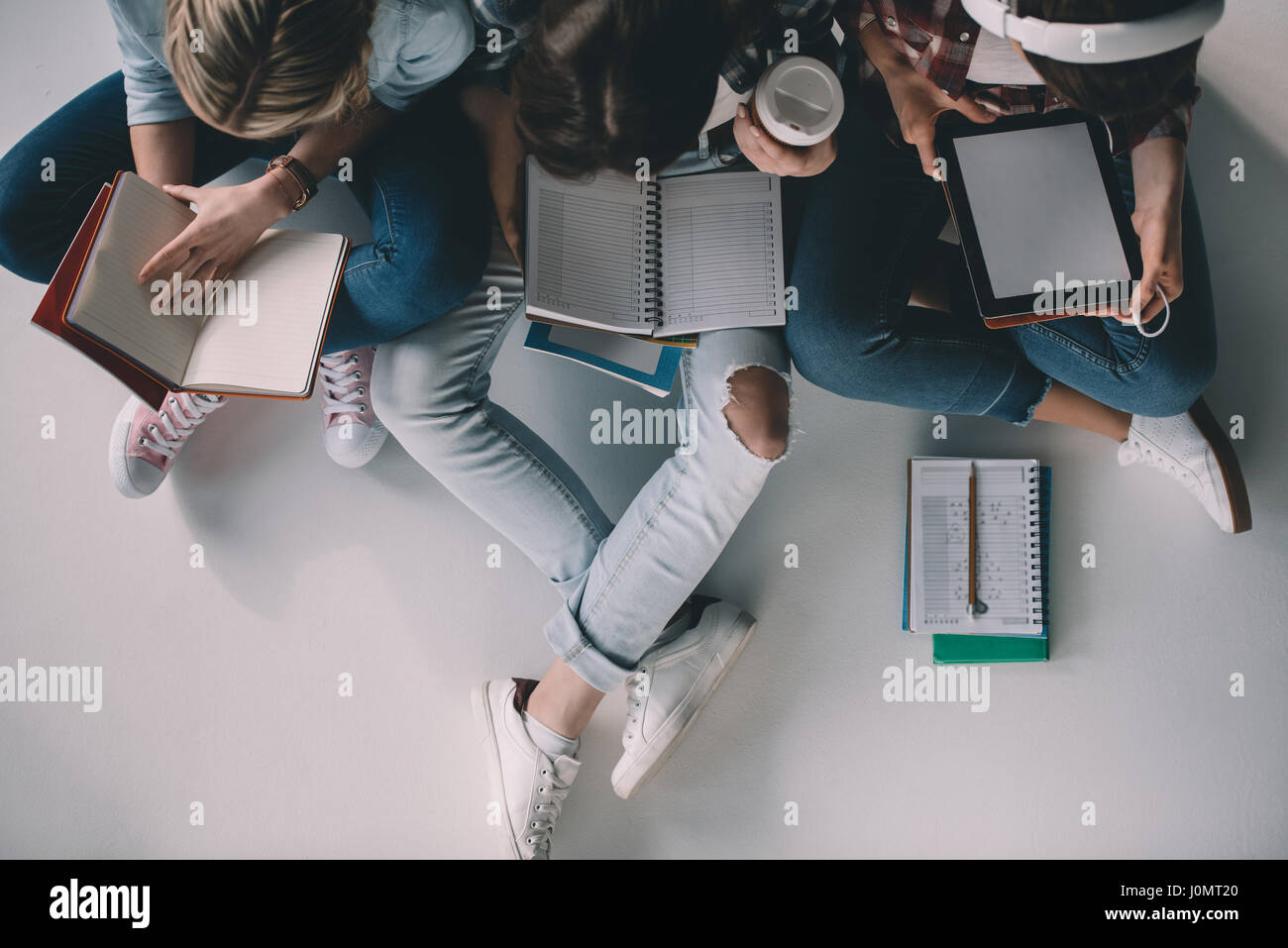 overhead view of women students studying together Stock Photo - Alamy