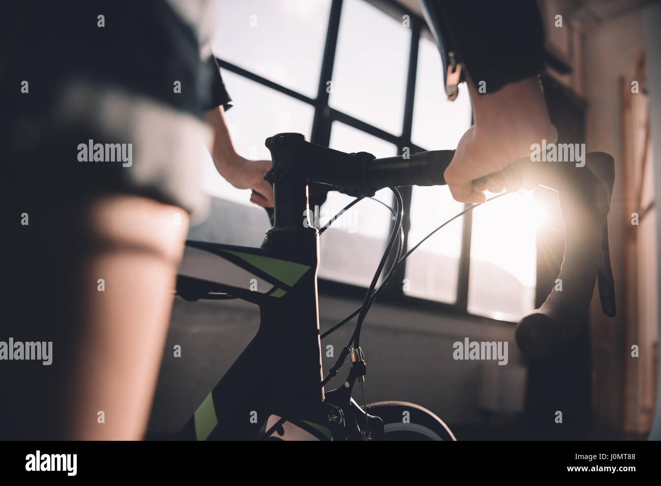 partial view of stylish woman riding sports bicycle Stock Photo - Alamy