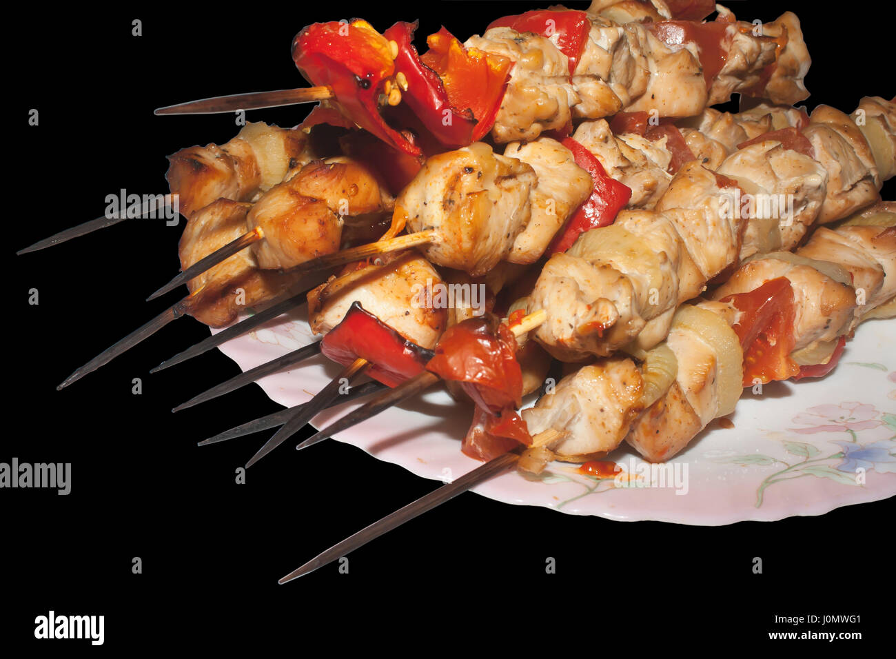 barbecue on plate isolated on black background Stock Photo - Alamy