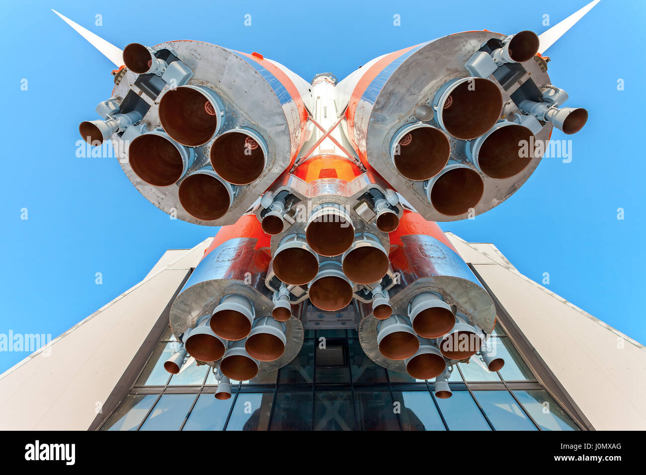 Russian space transport rocket with rocket engines against the blue sky ...