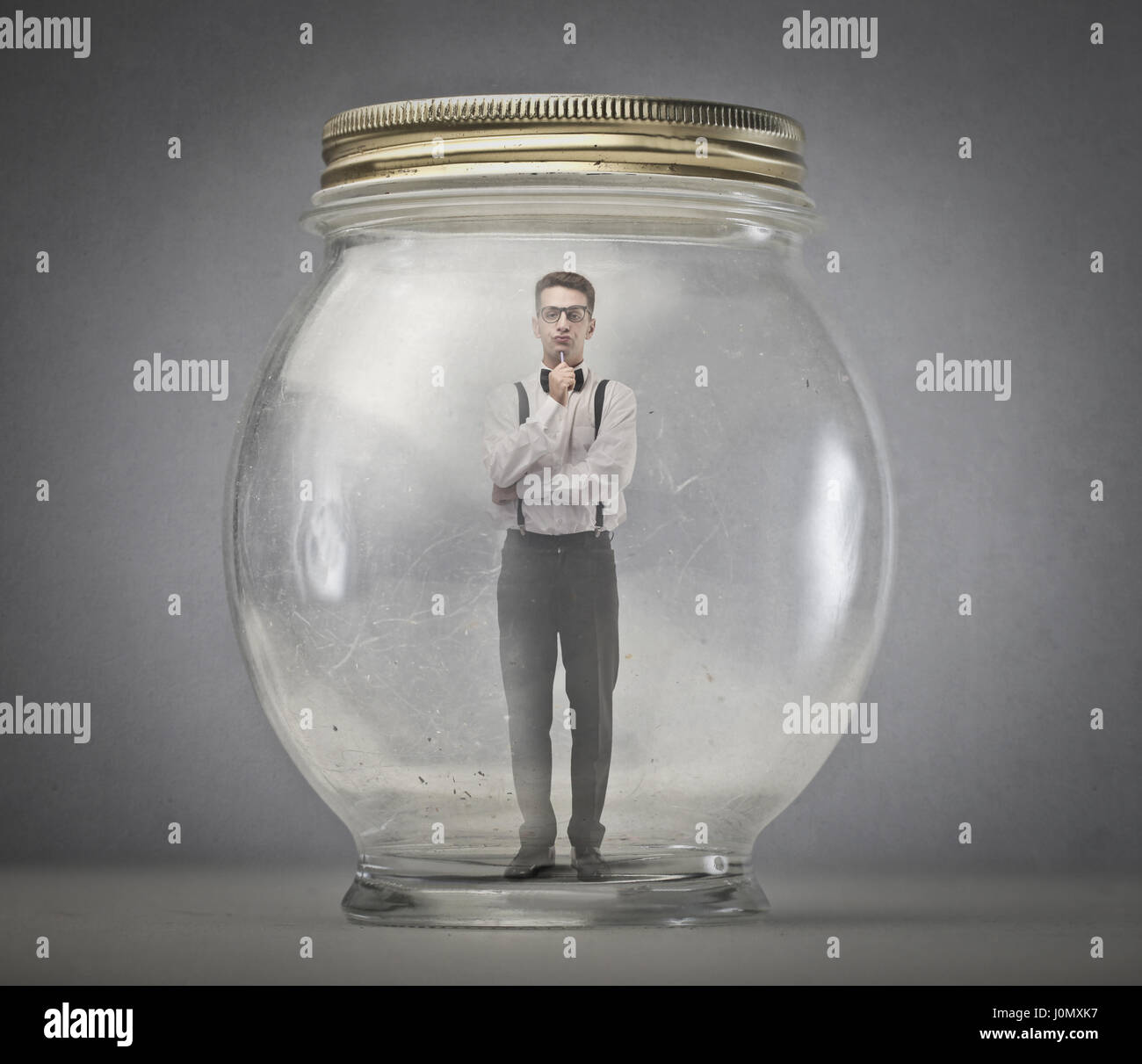Man stuck in jar Stock Photo - Alamy