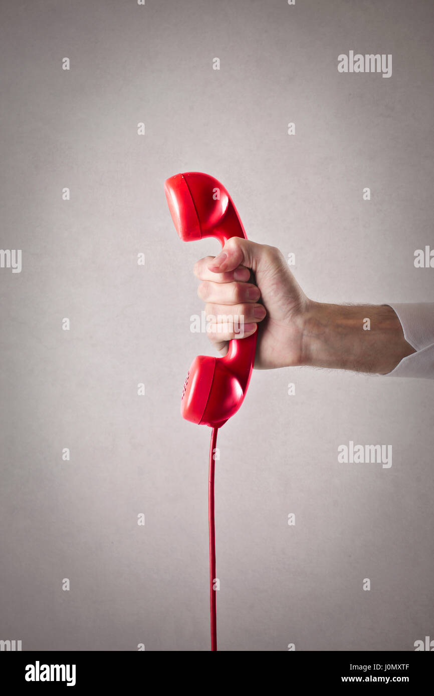 Hand red telephone receiver hi-res stock photography and images - Alamy