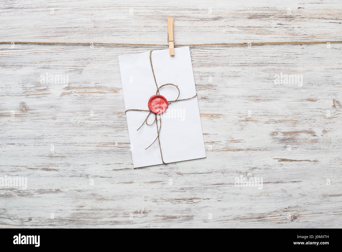 Mail envelope on rope Stock Photo - Alamy