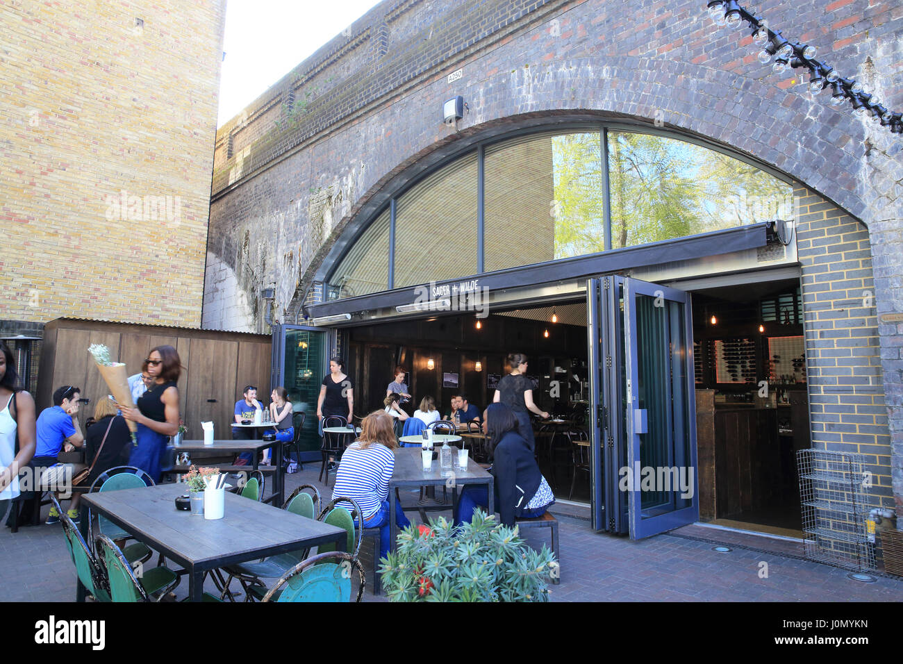 Trendy bars and restaurants on Paradise Row, underneath the railway ...
