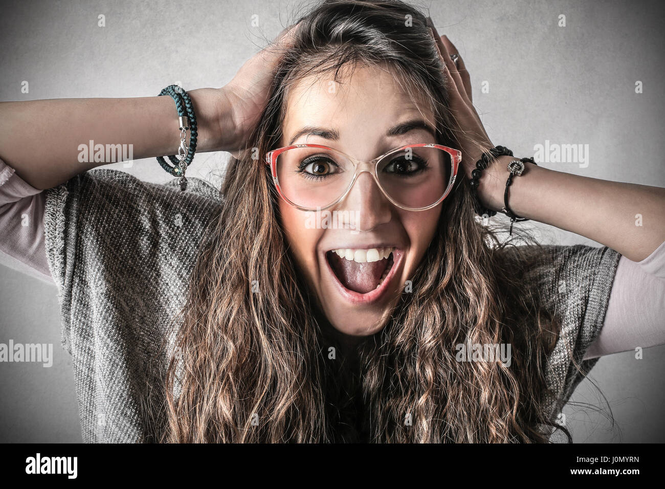 Brunette woman being very happy Stock Photo - Alamy