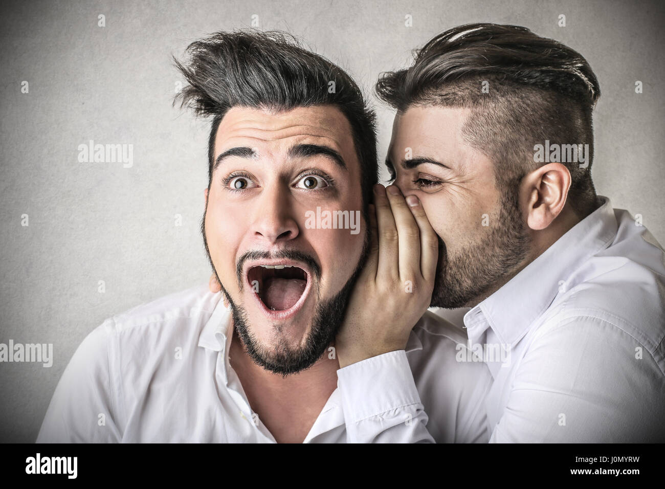 Telling secrets boy hi-res stock photography and images - Alamy