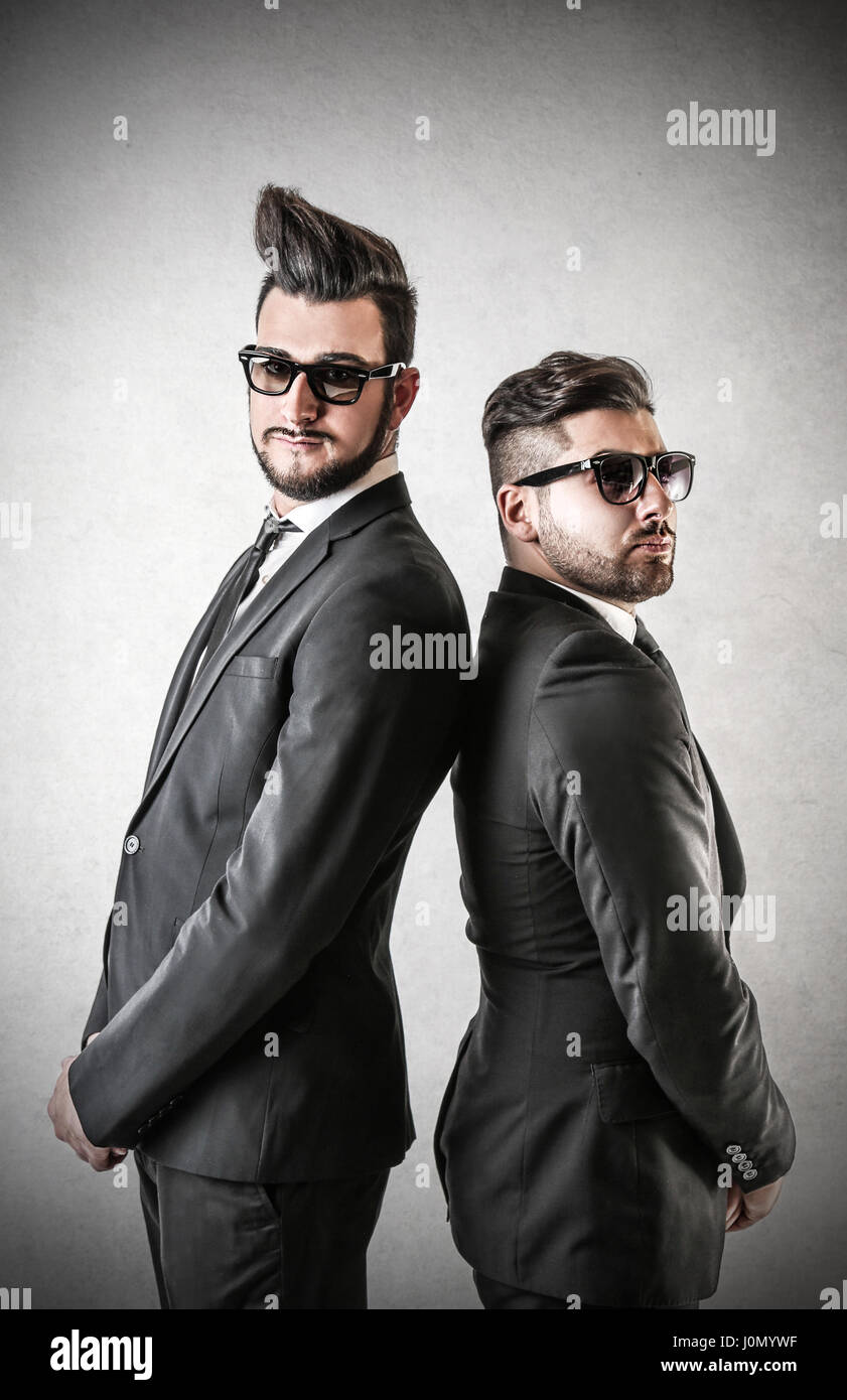 2 businessmen back to back Stock Photo - Alamy